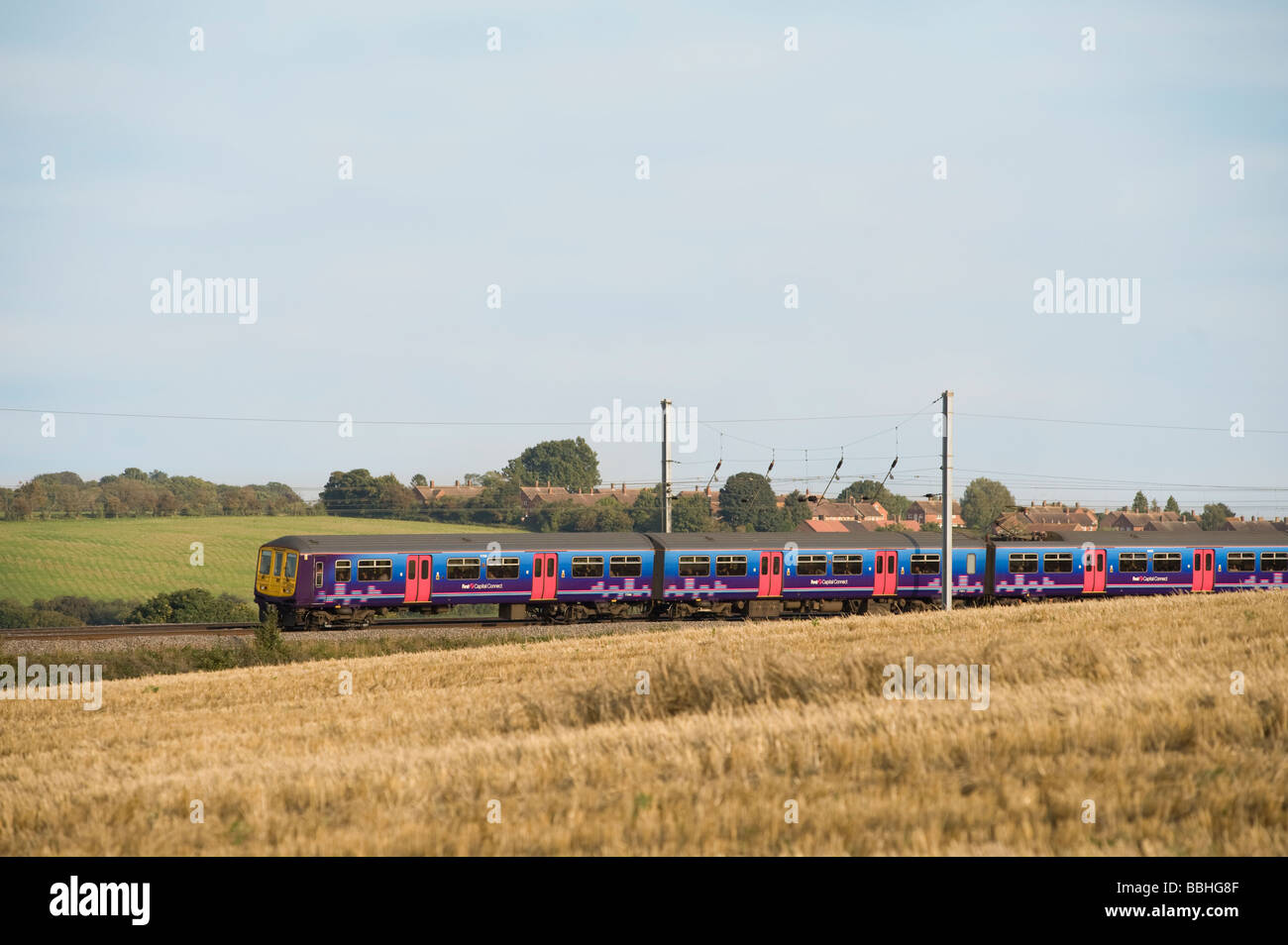 Passenger train class 319 in First Capital Connect livery speeding ...