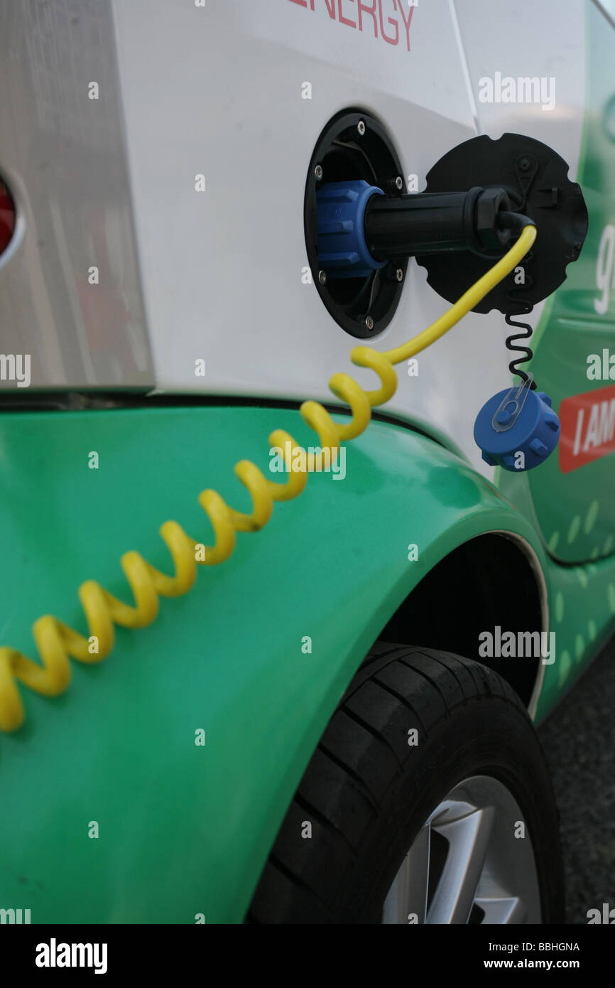 Electric car being charged Stock Photo - Alamy