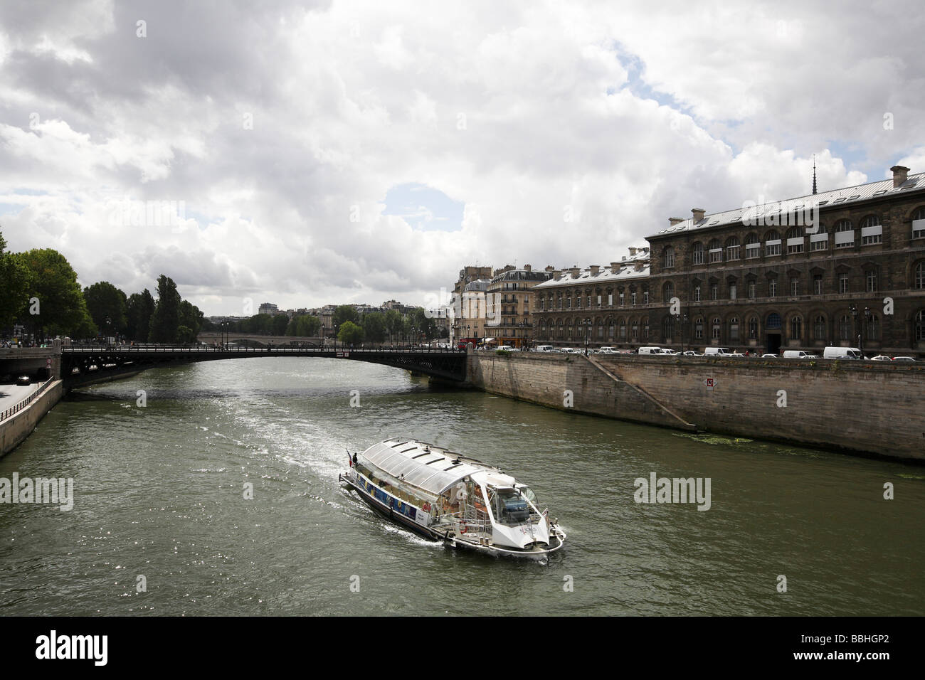 France Paris Tourist river bus travelling along the Seine Stock Photo ...
