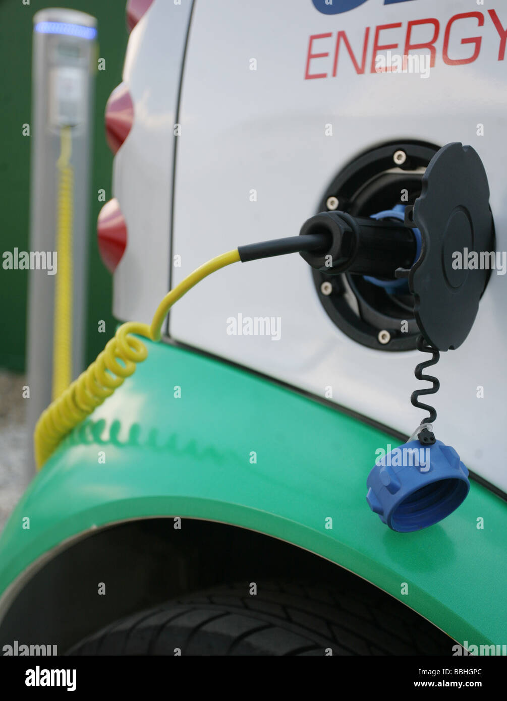 Electric car being charged Stock Photo - Alamy