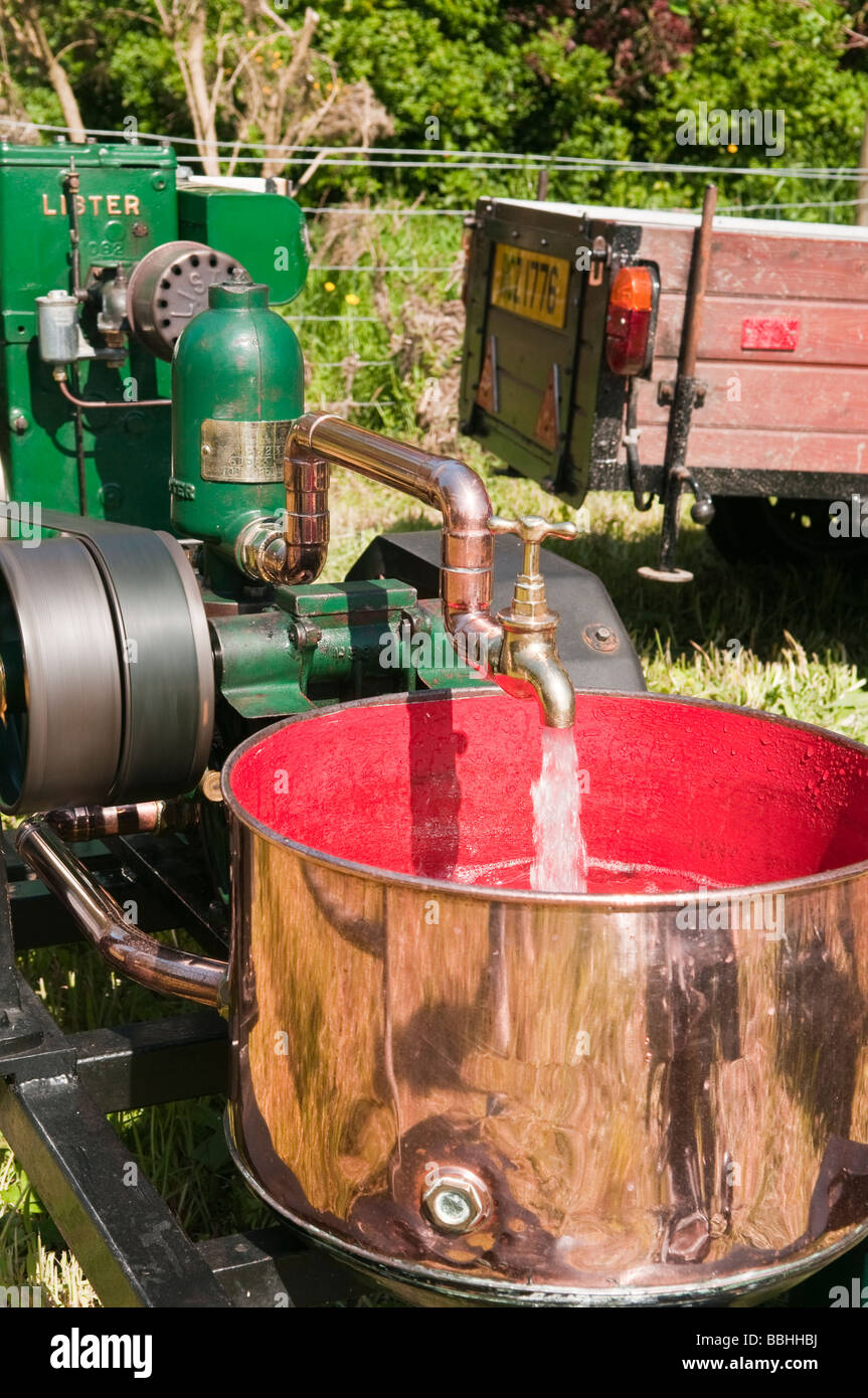Steam powered water pump, pumping water into large brass cylinder Stock ...