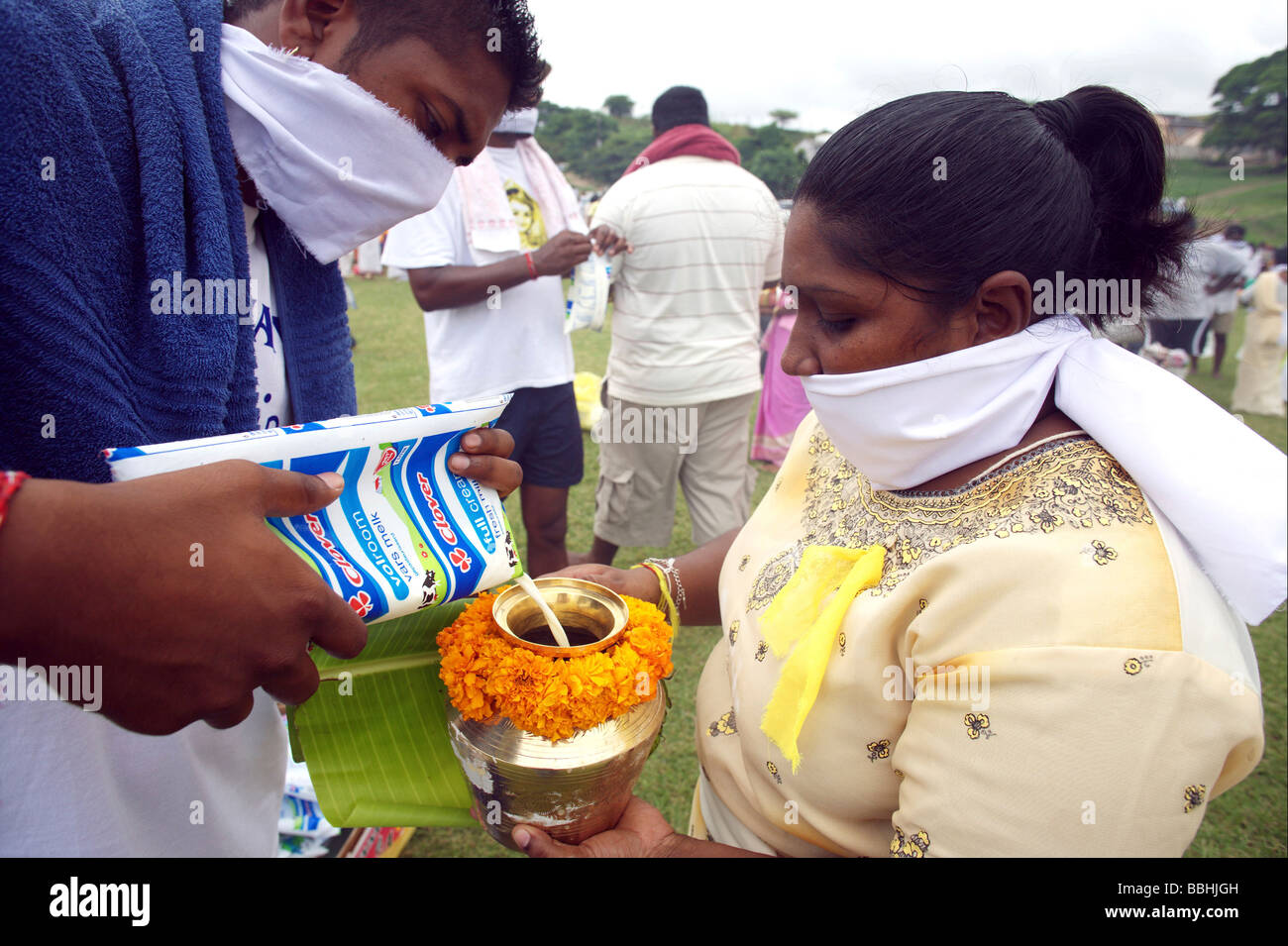 DURBAN SOUTH AFRICA A Hindu devotee collects blessed milk as many ...