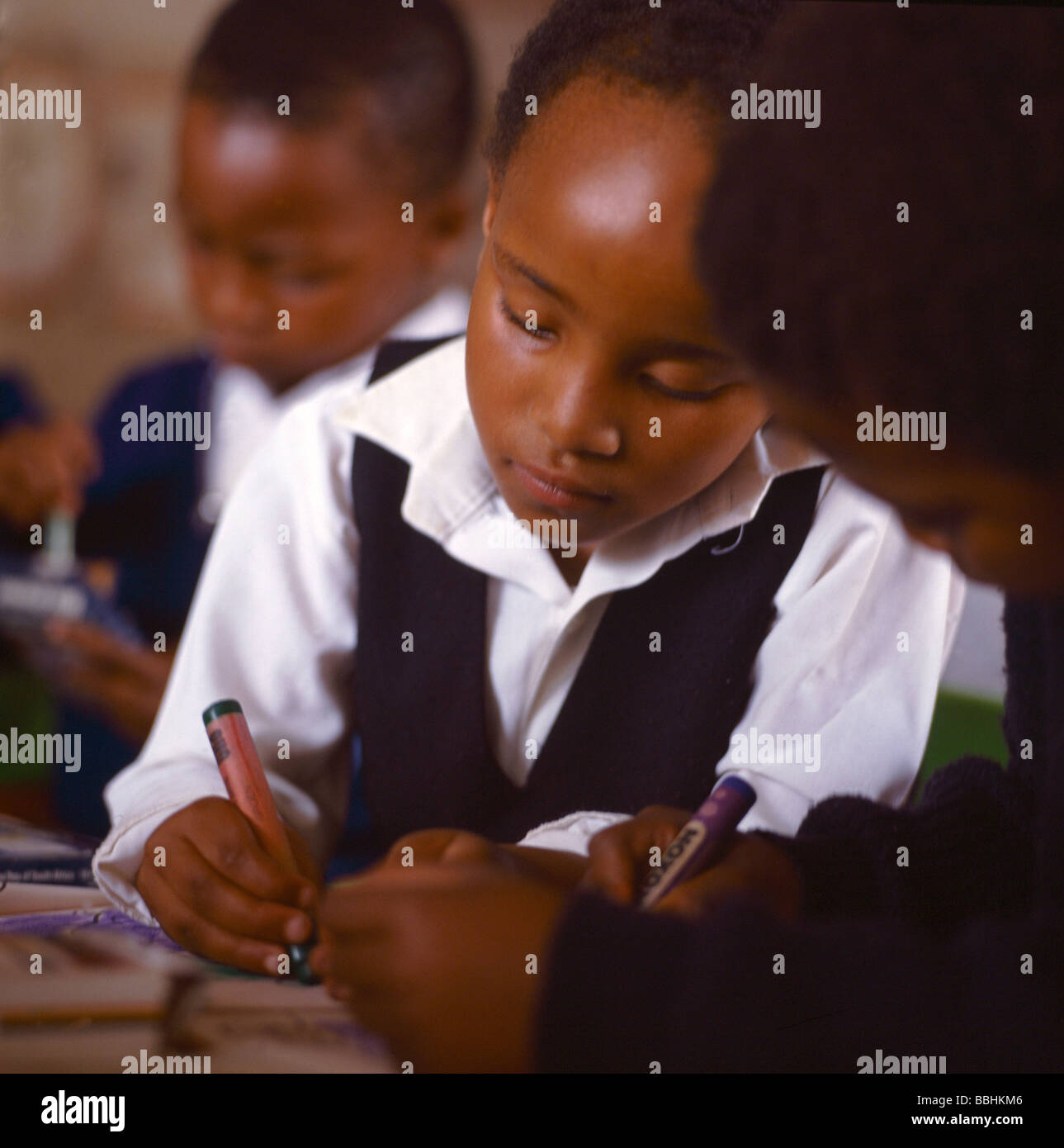 Primary school student colouring in during class Stock Photo - Alamy