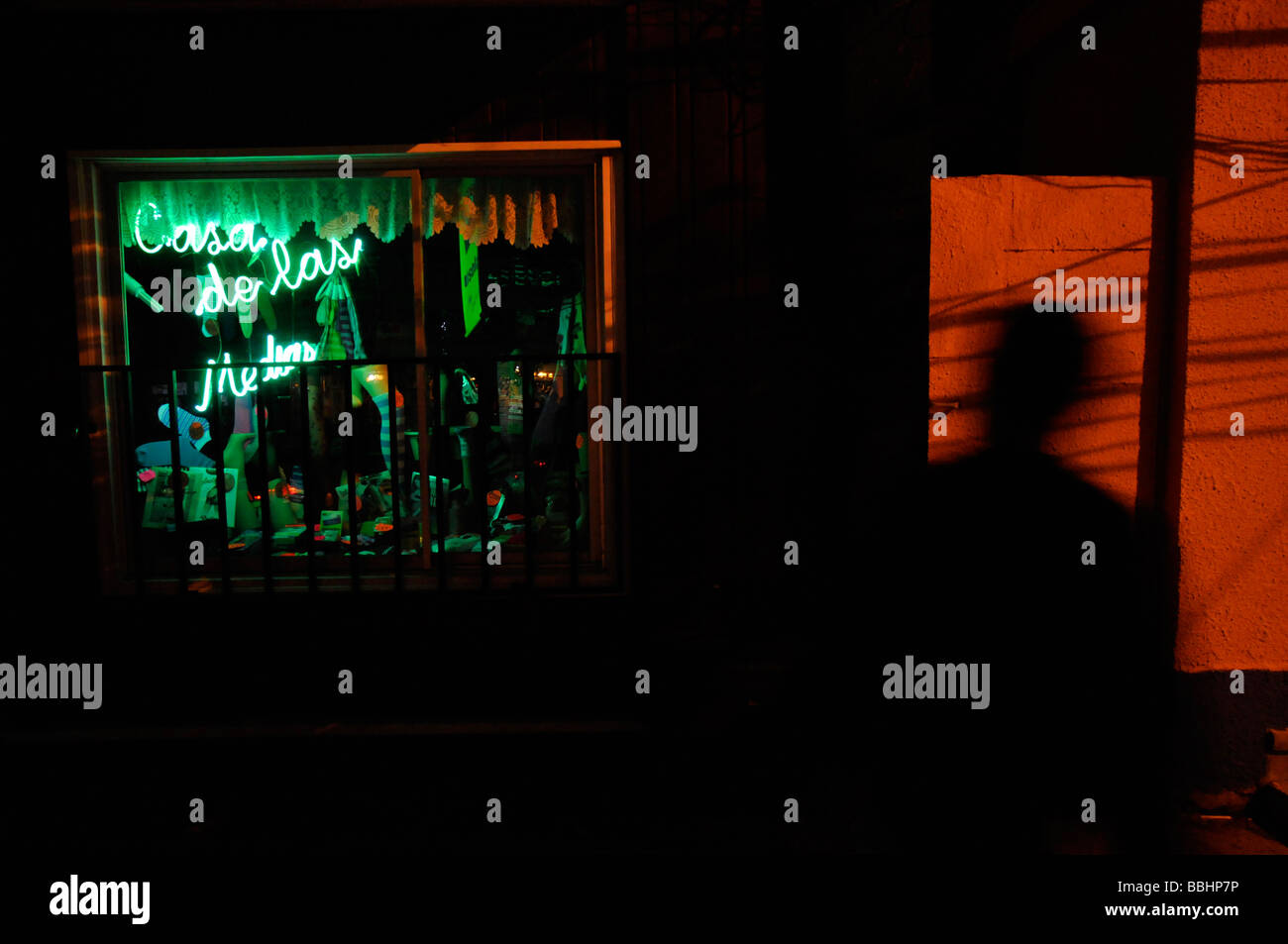 Storefront at night Stock Photo - Alamy