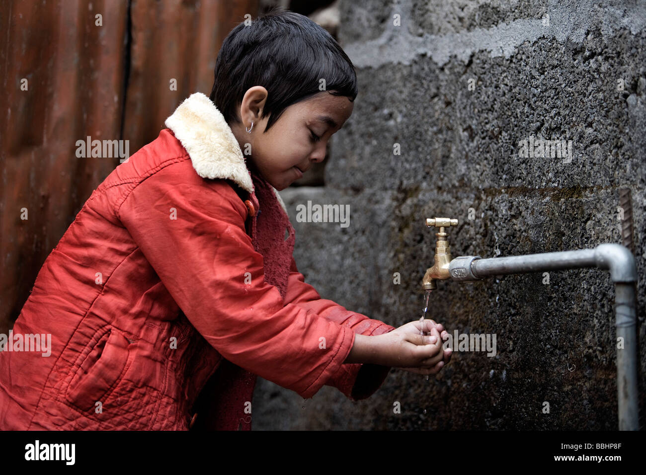 Orphaned girl washing at orphanage hi-res stock photography and images ...
