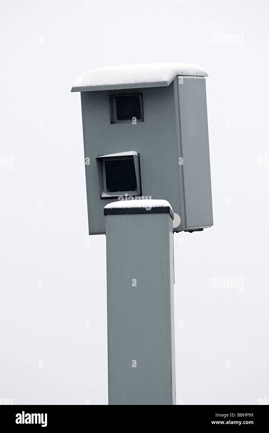 a traffic light camera or gatso on a main road with snow on it Stock ...