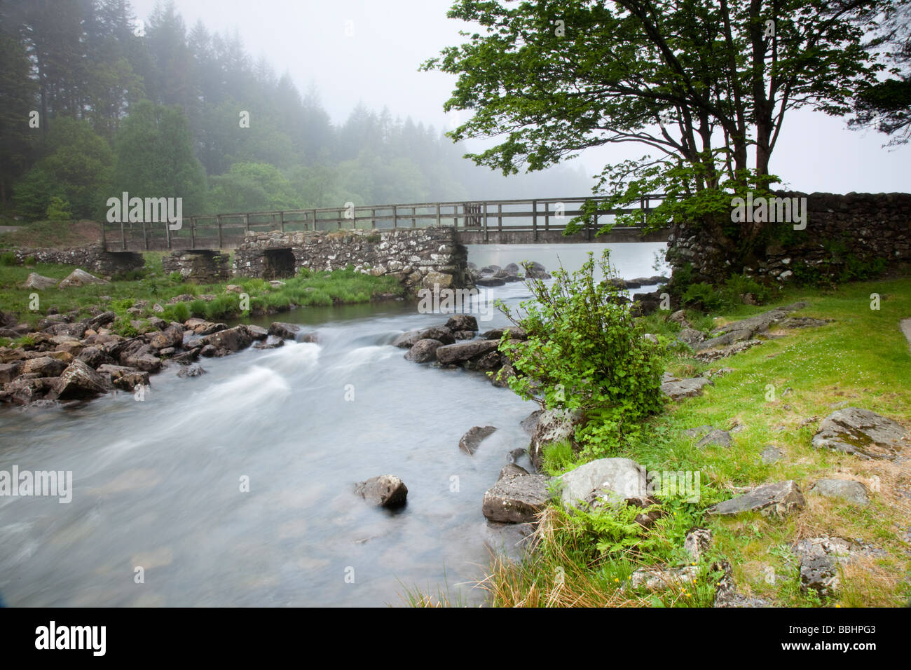 Stream leaving llynnau mymbyr in the heart of Snowdonia National Park ...