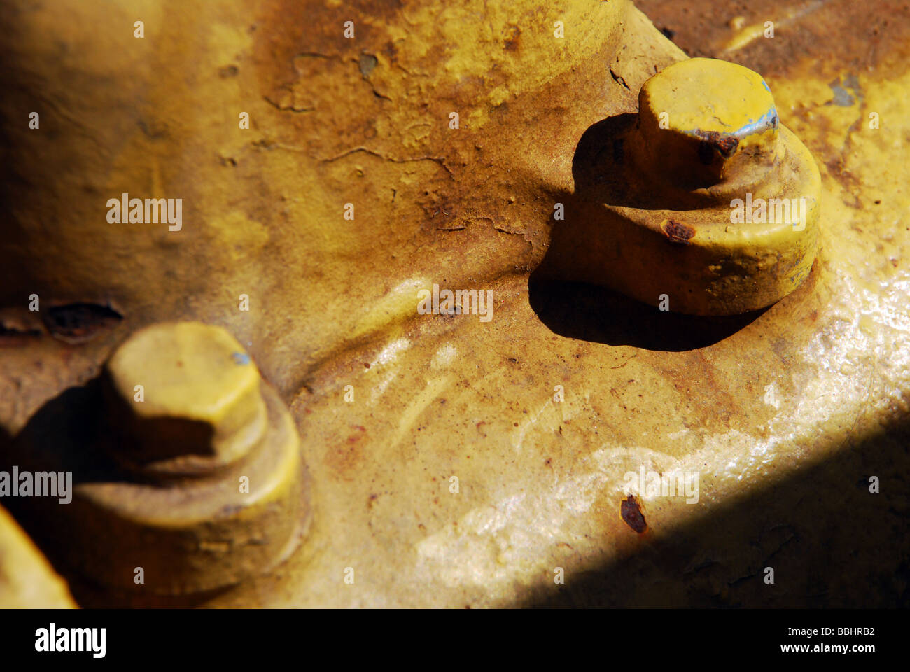 Yellow Painted Bolts Stock Photo - Alamy