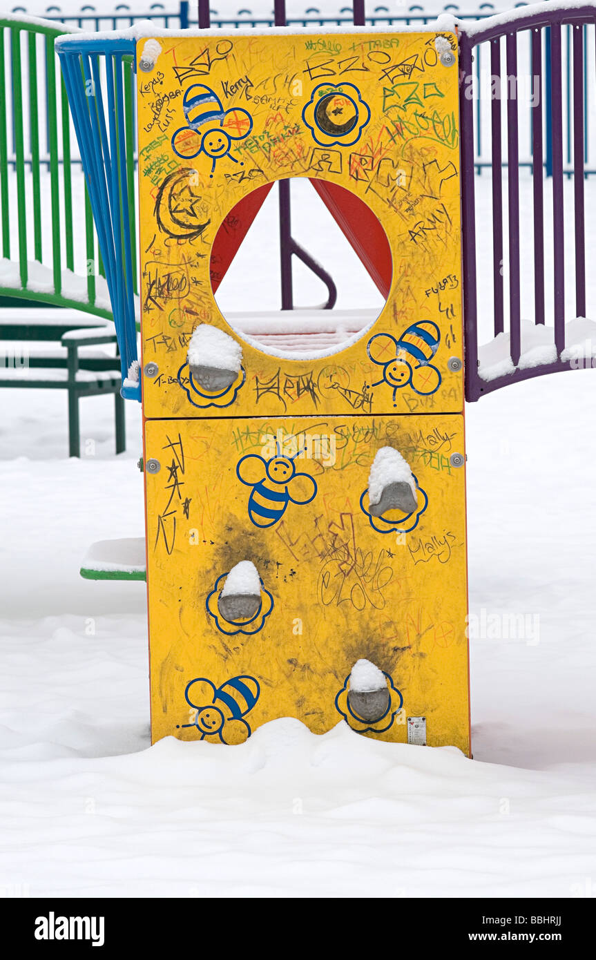 a playground with graffiti written all over the climbing frame Stock ...