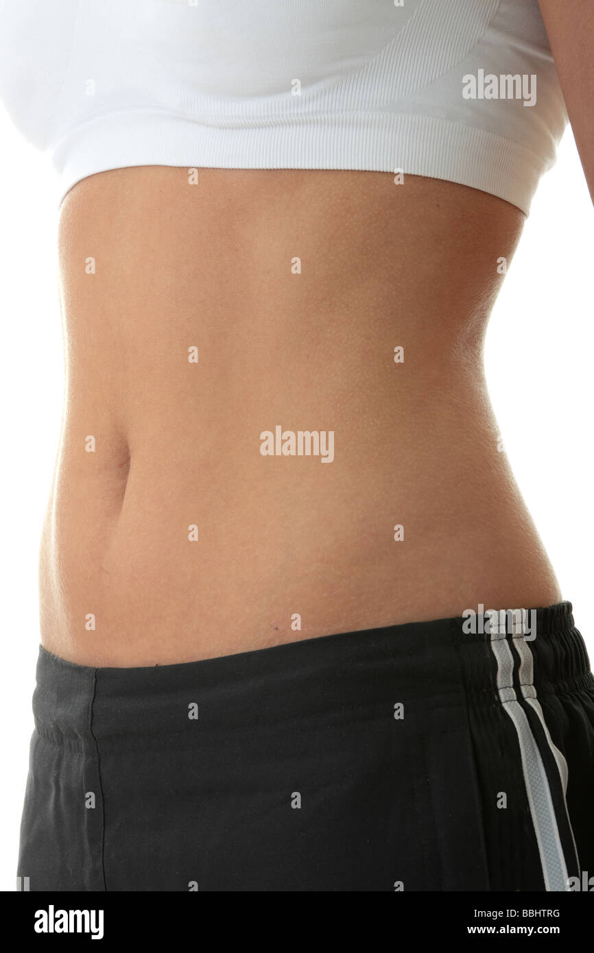 Midsection of a physically fit young woman over white background Stock ...