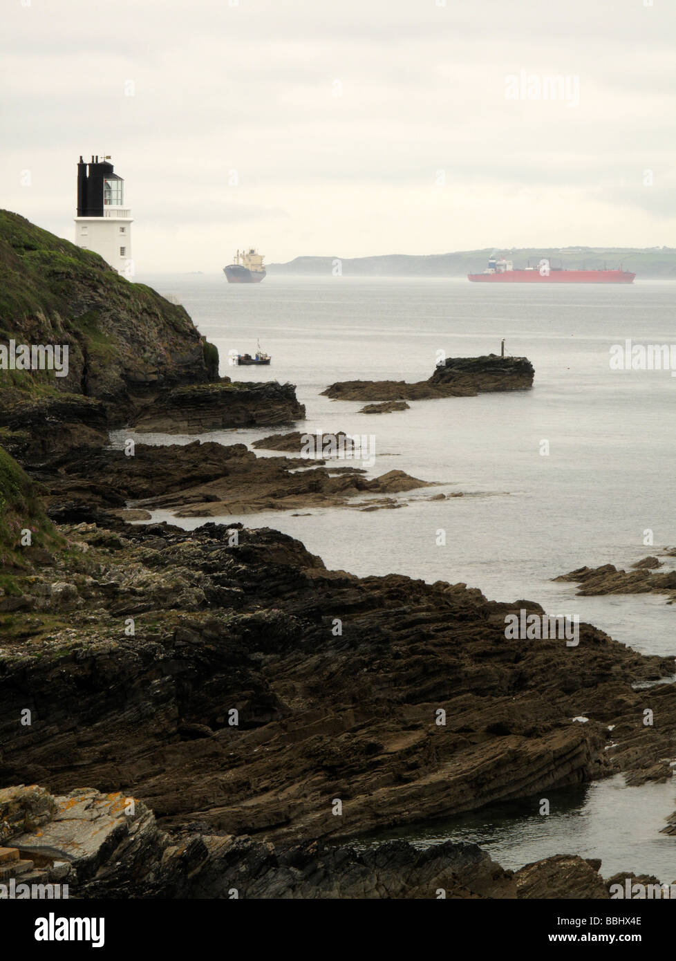 lighthouse sea and ships Stock Photo - Alamy