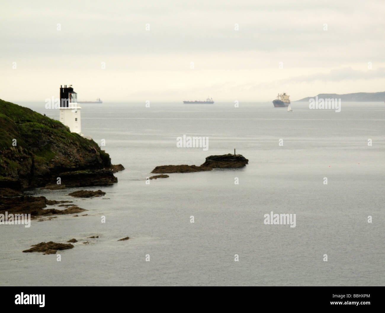 lighthouse sea and ships Stock Photo - Alamy