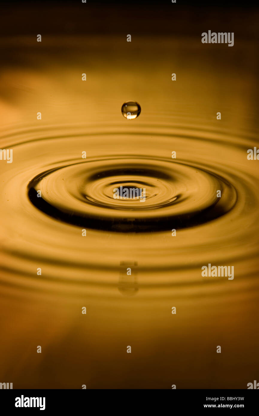 Single drop of water falling Stock Photo - Alamy