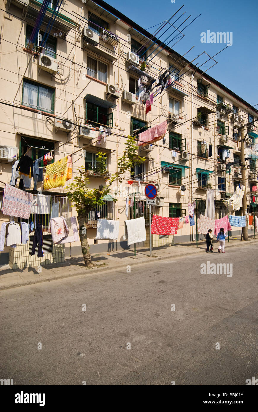 Exterior of apartment building with hanging laundry Shanghai China ...