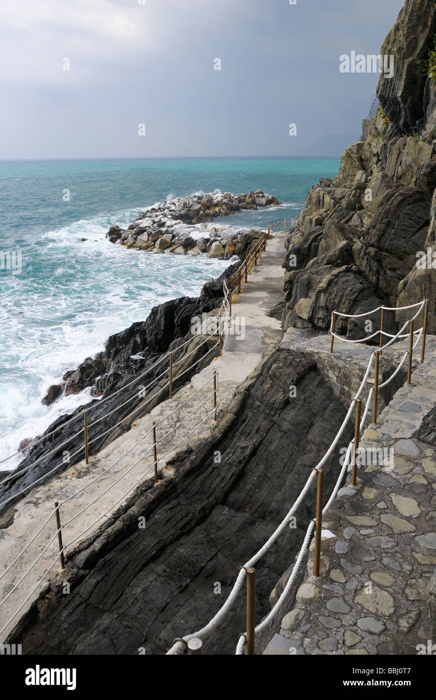 The surf breaker at the entrance to the harbor of the small village of ...