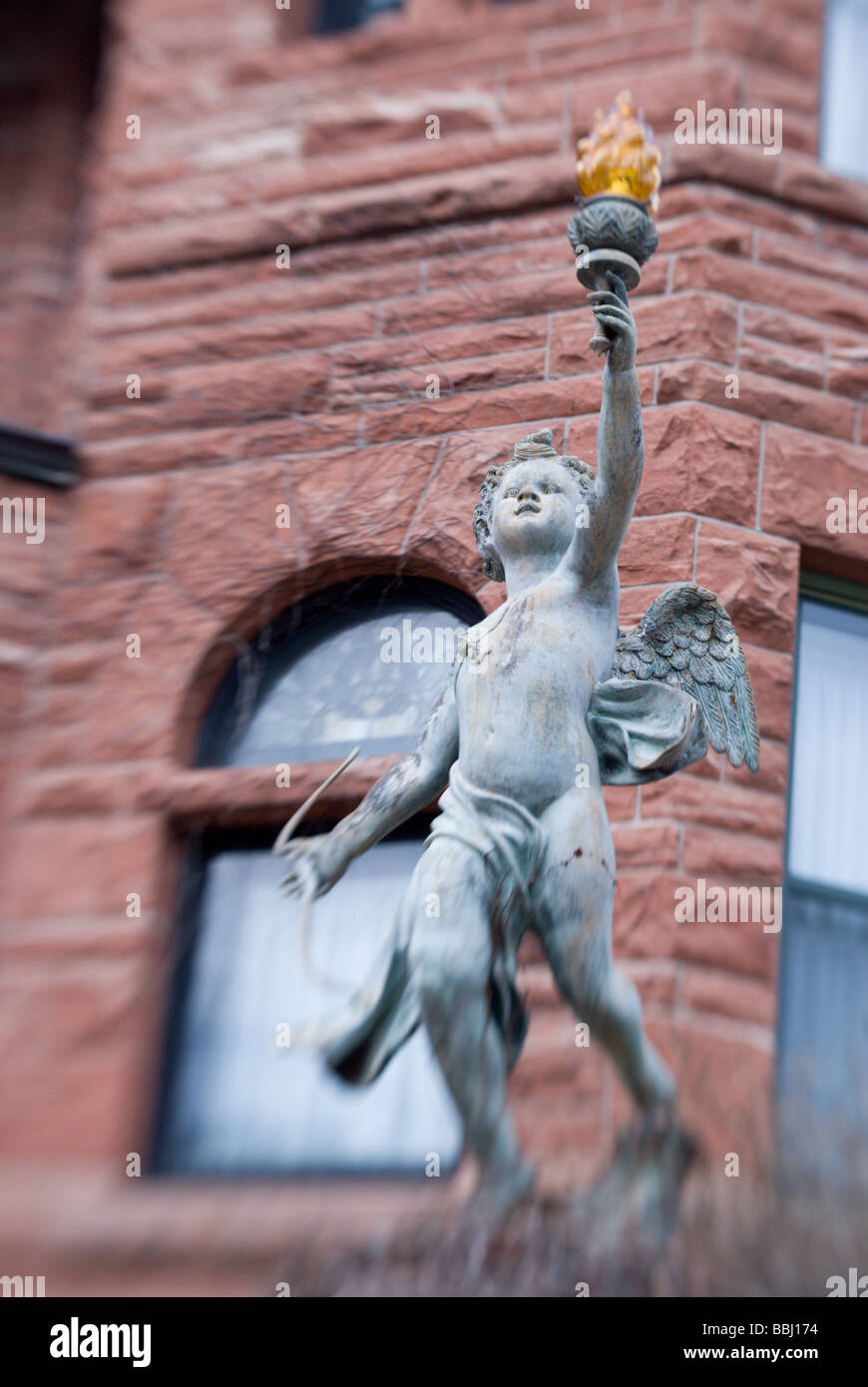 Statue with a torch in downtown Dubuque, IA Stock Photo - Alamy