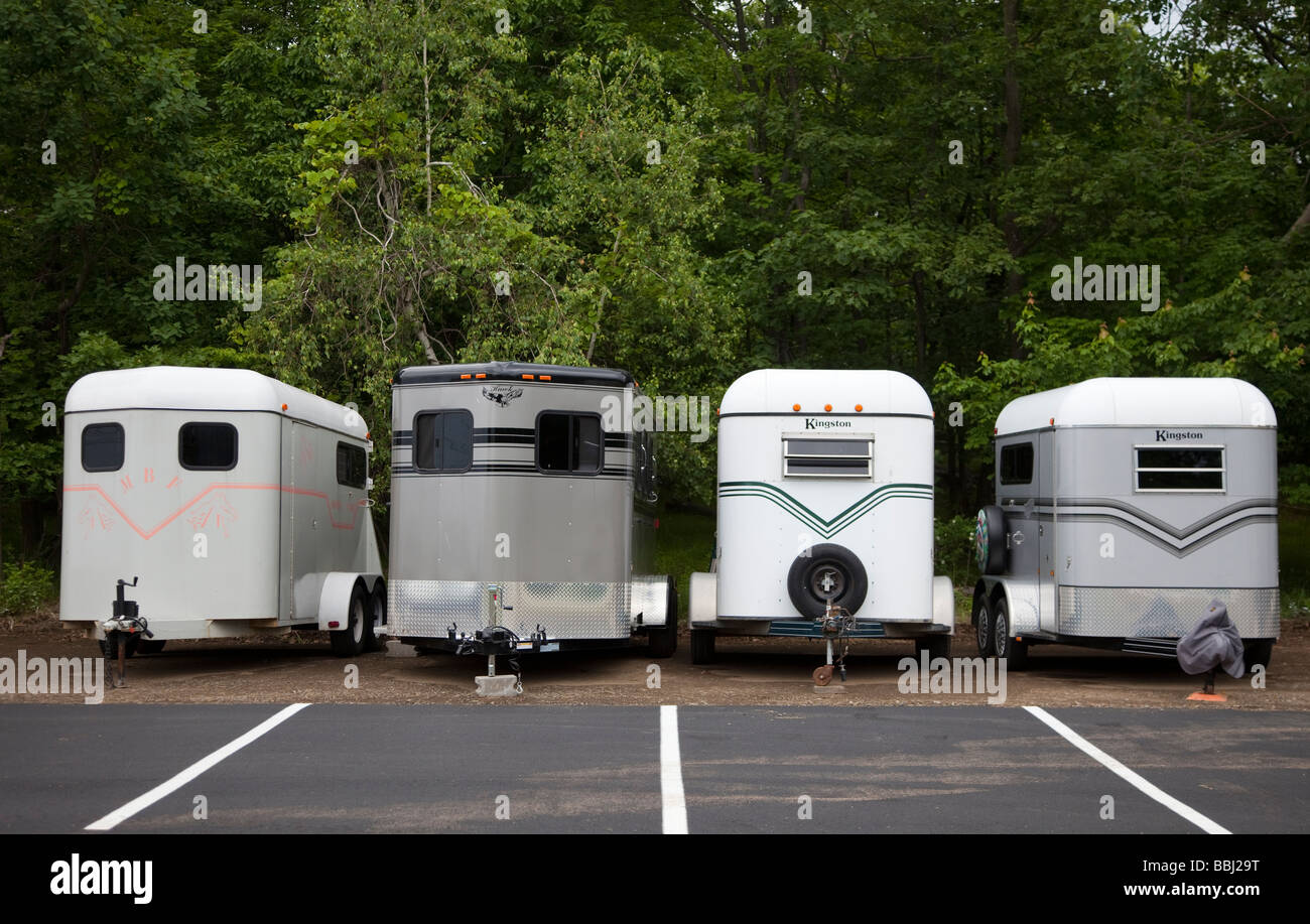 Four horse trailers lined up Stock Photo - Alamy