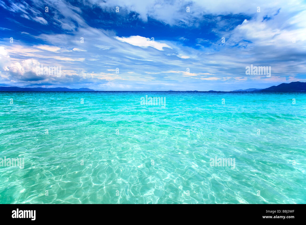 Blue clean sea and cloudy sky landscape Stock Photo - Alamy