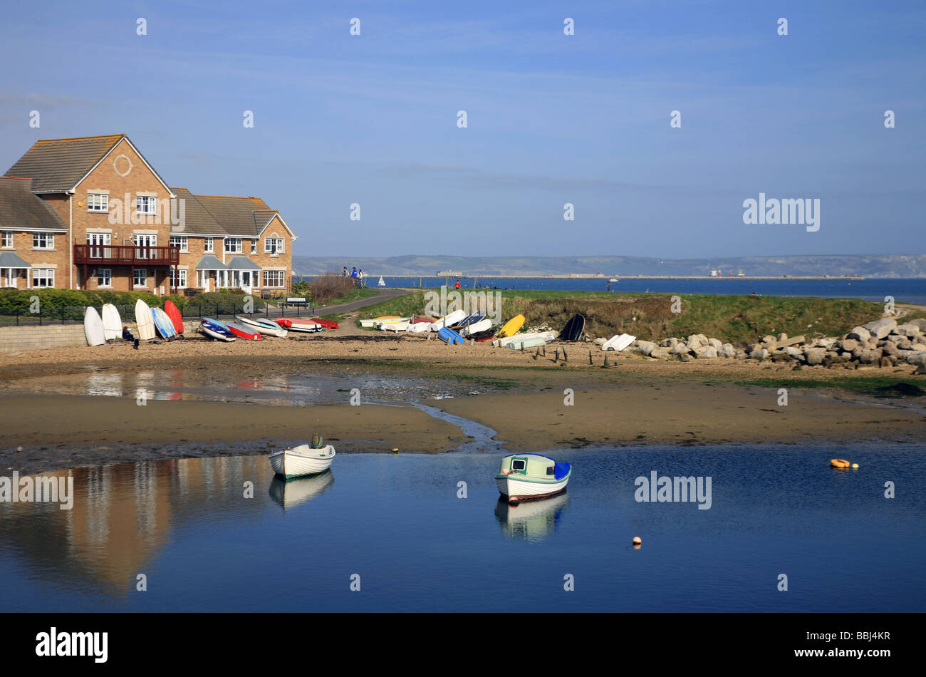 Picturesque cove at Ferry Bridge on Portland Harbour near the road ...
