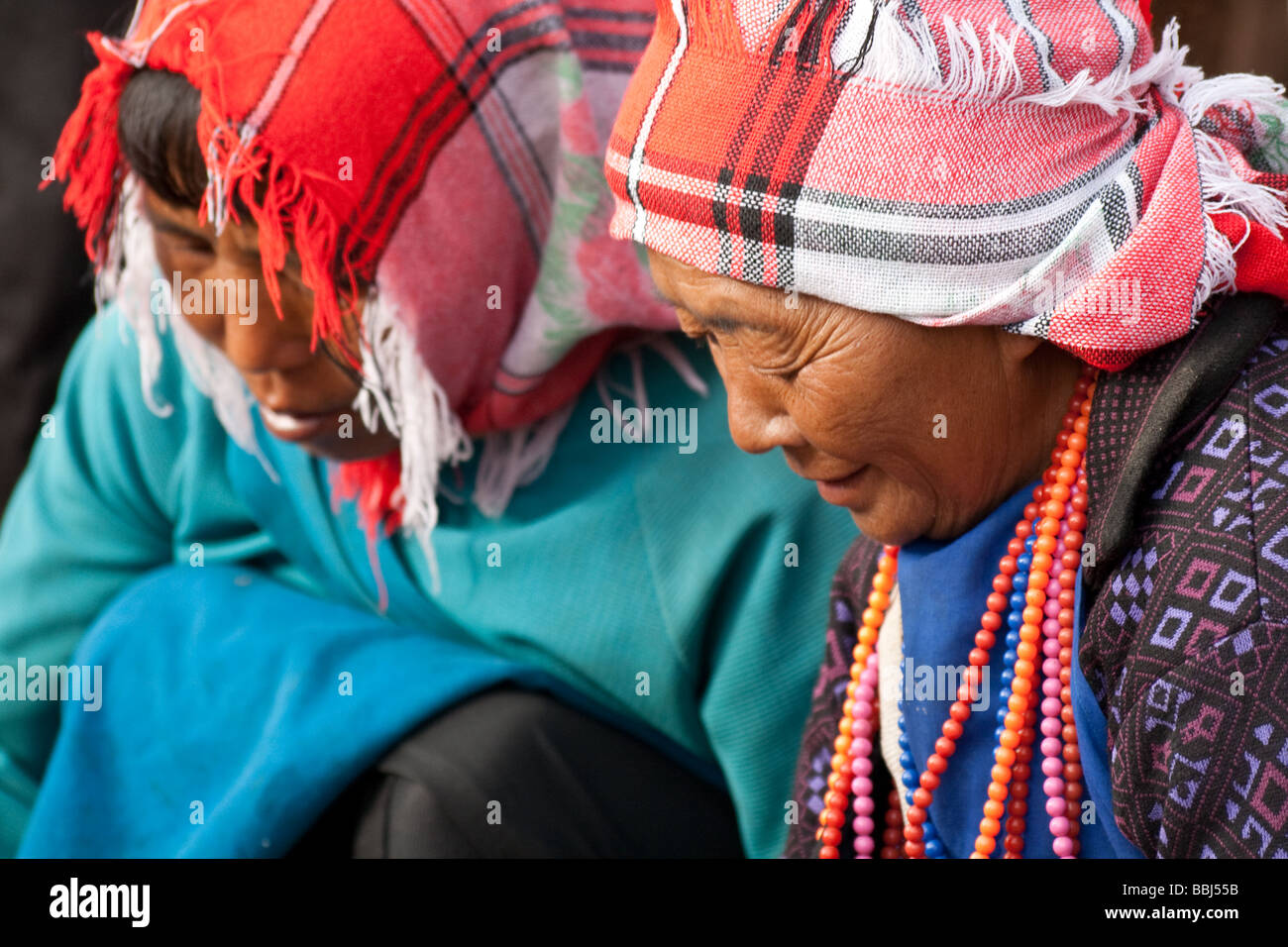 A Hani tribal women wearing traditional headscarf at Xiding market in ...