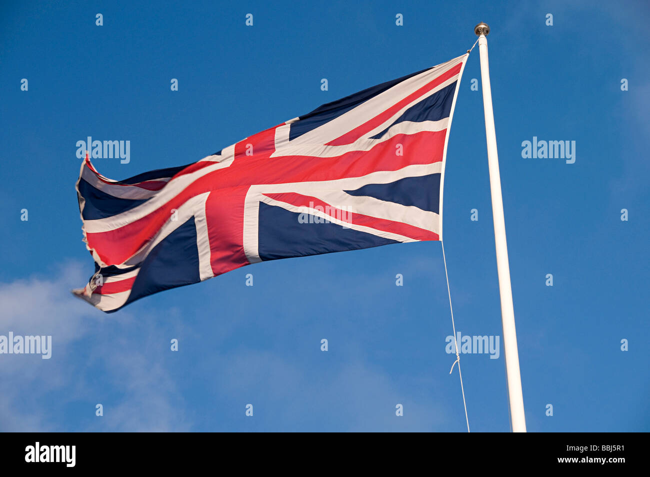 a union jack flag waving in the wind Stock Photo - Alamy
