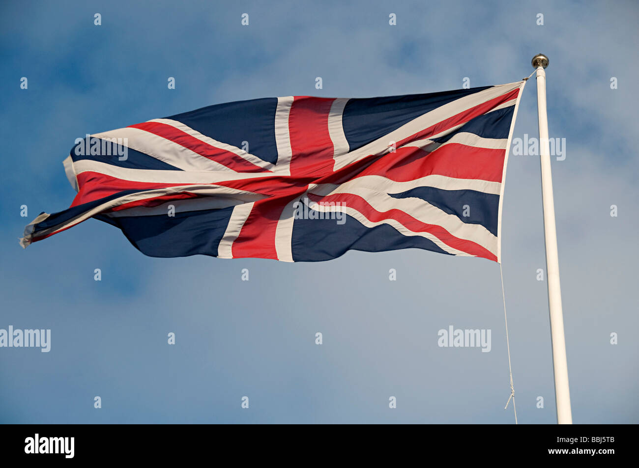 a union jack flag waving in the wind Stock Photo - Alamy
