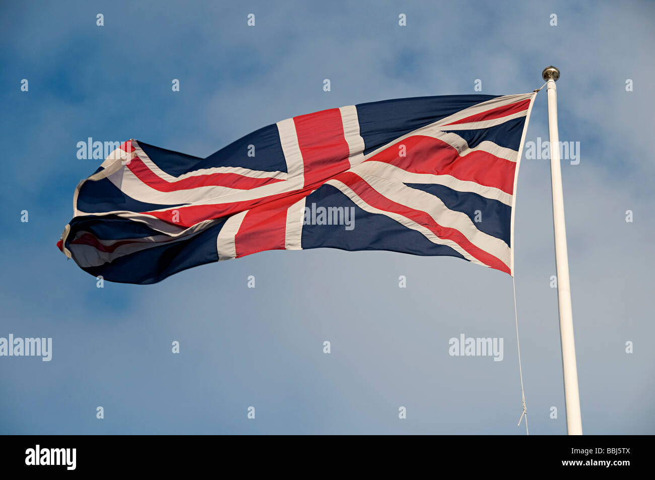 a union jack flag waving in the wind Stock Photo - Alamy