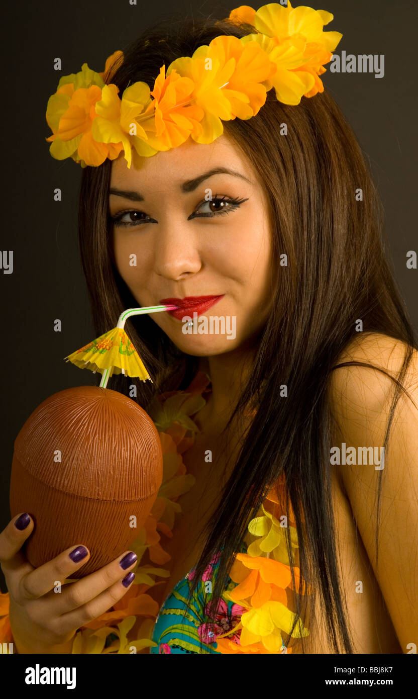 hula girl drinking from coconut Stock Photo - Alamy