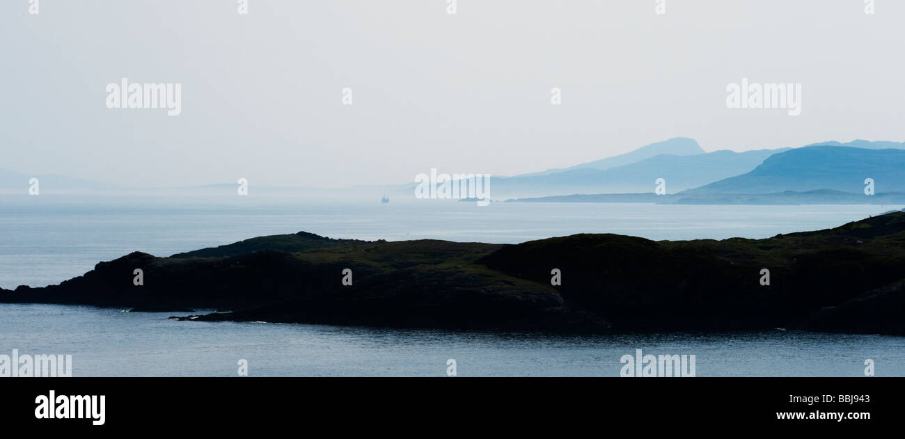 Hazy blue eastern coastline and sea, South harris, Isle of Harris ...