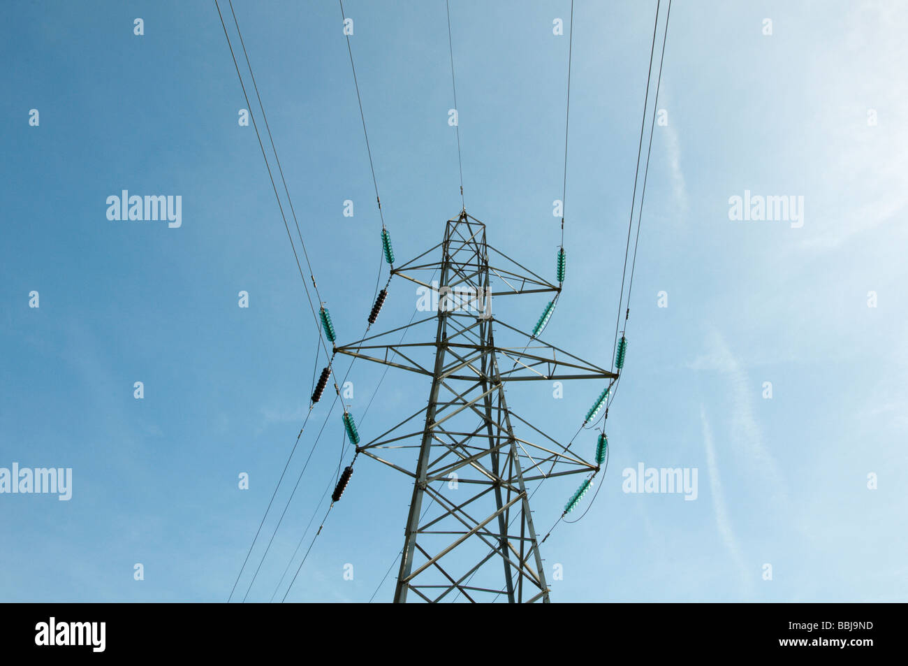 A electrical pylon with a blue sky Stock Photo - Alamy