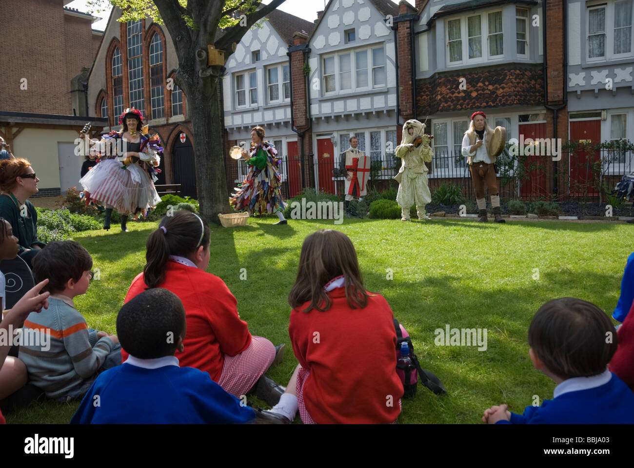 Schoolchildren watch St George and the Dragon, an English traditional ...