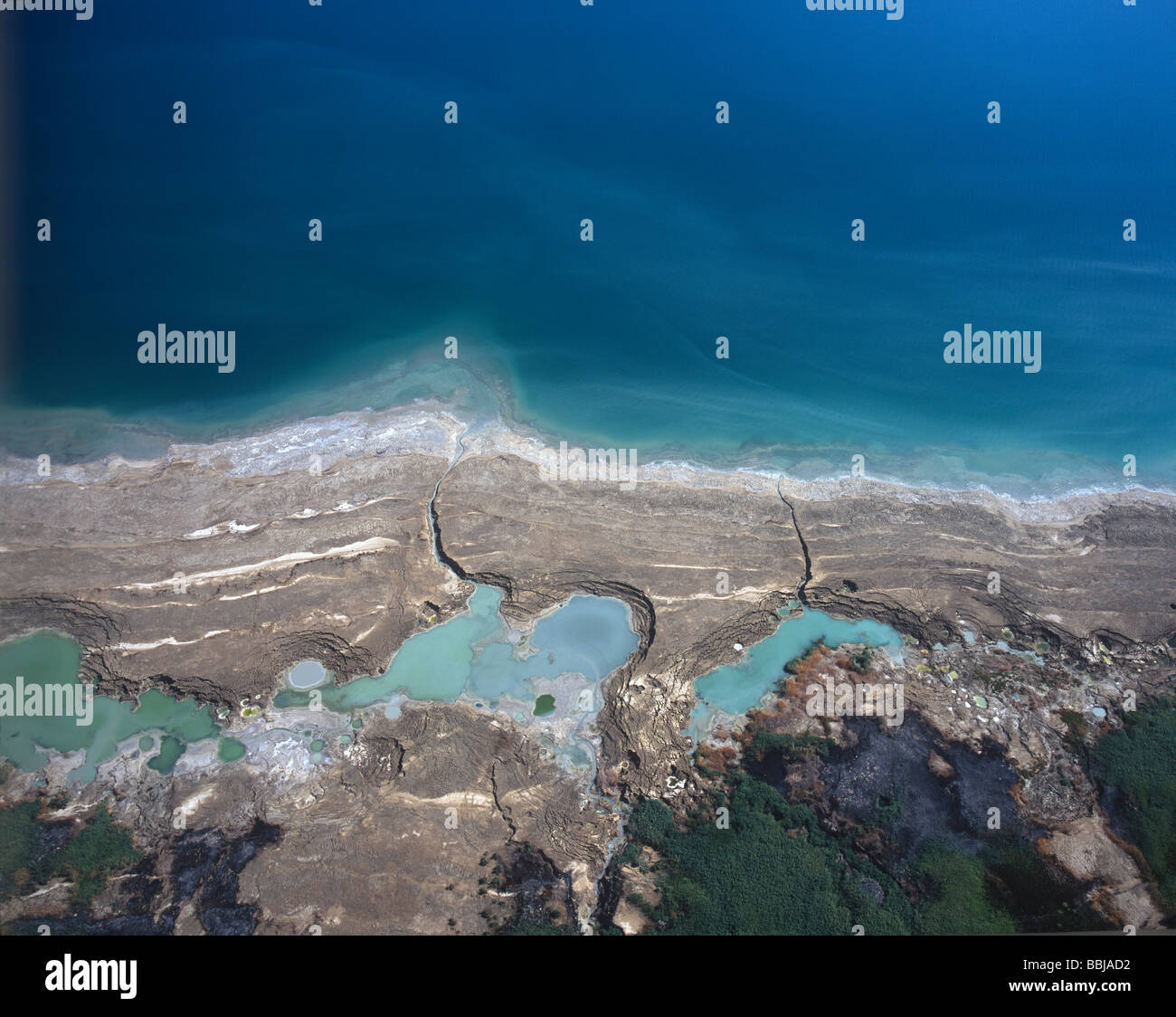 Israel Aerial of the Dead Sea with pools showing the receding water ...