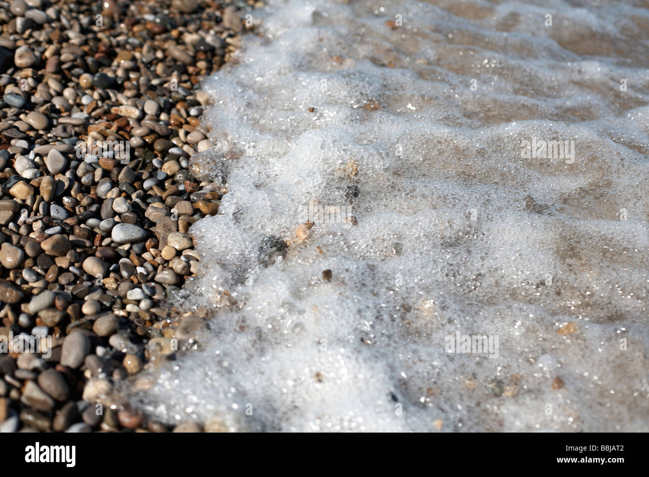 Tide washing over pebbles, Ontario Stock Photo - Alamy