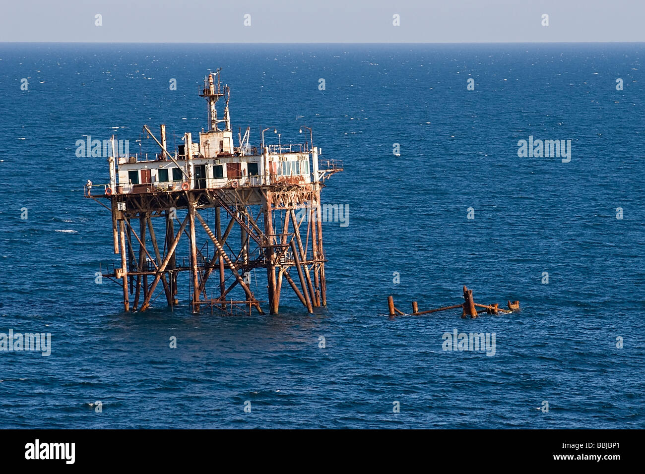 rusty tower of sunk ship prominent above sea surface Stock Photo - Alamy