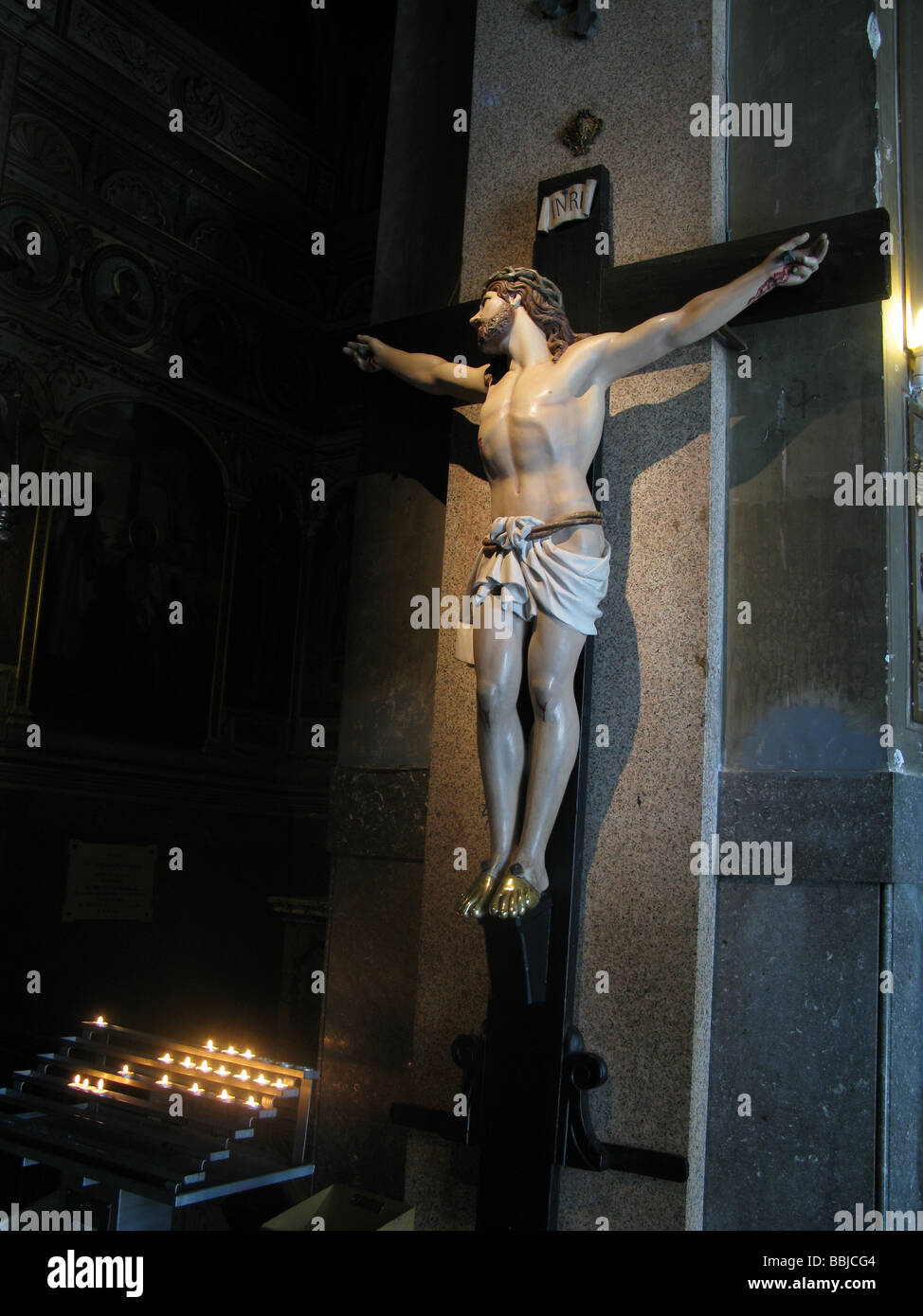 jesus on cross statue in church in rome italy Stock Photo - Alamy