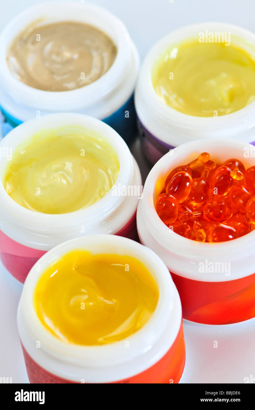 Colorful jars of skin care creams and lotions Stock Photo - Alamy