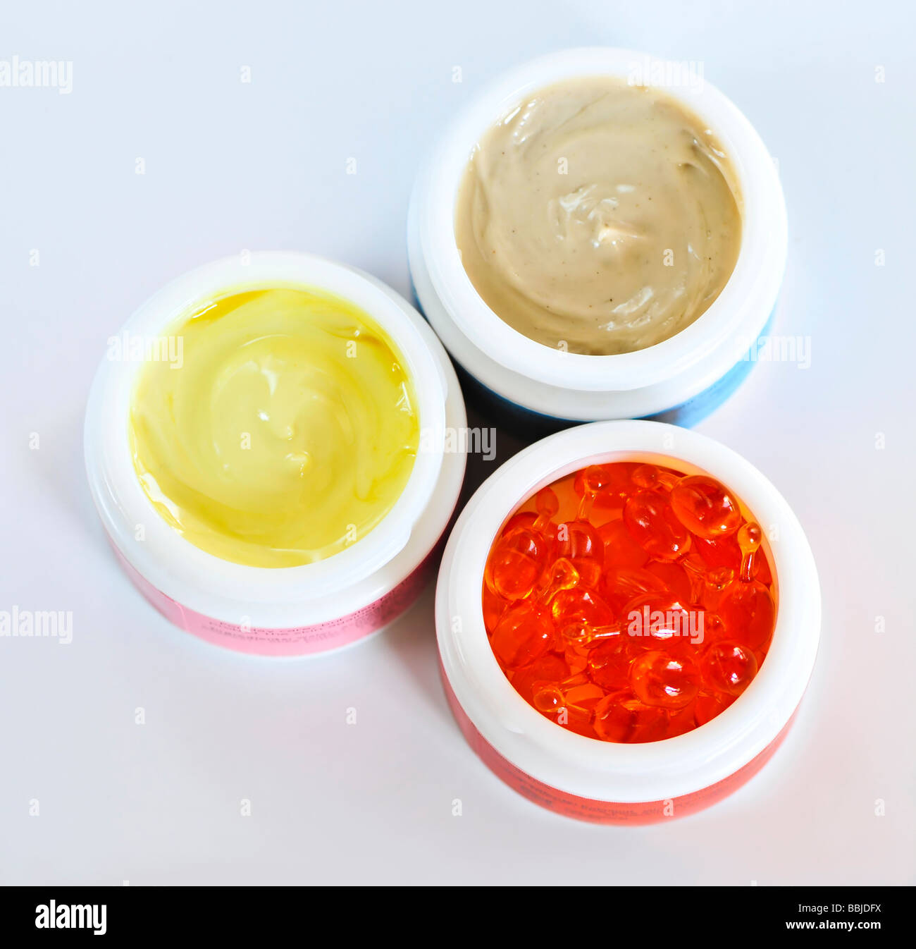 Colorful jars of skin care creams and lotions Stock Photo - Alamy