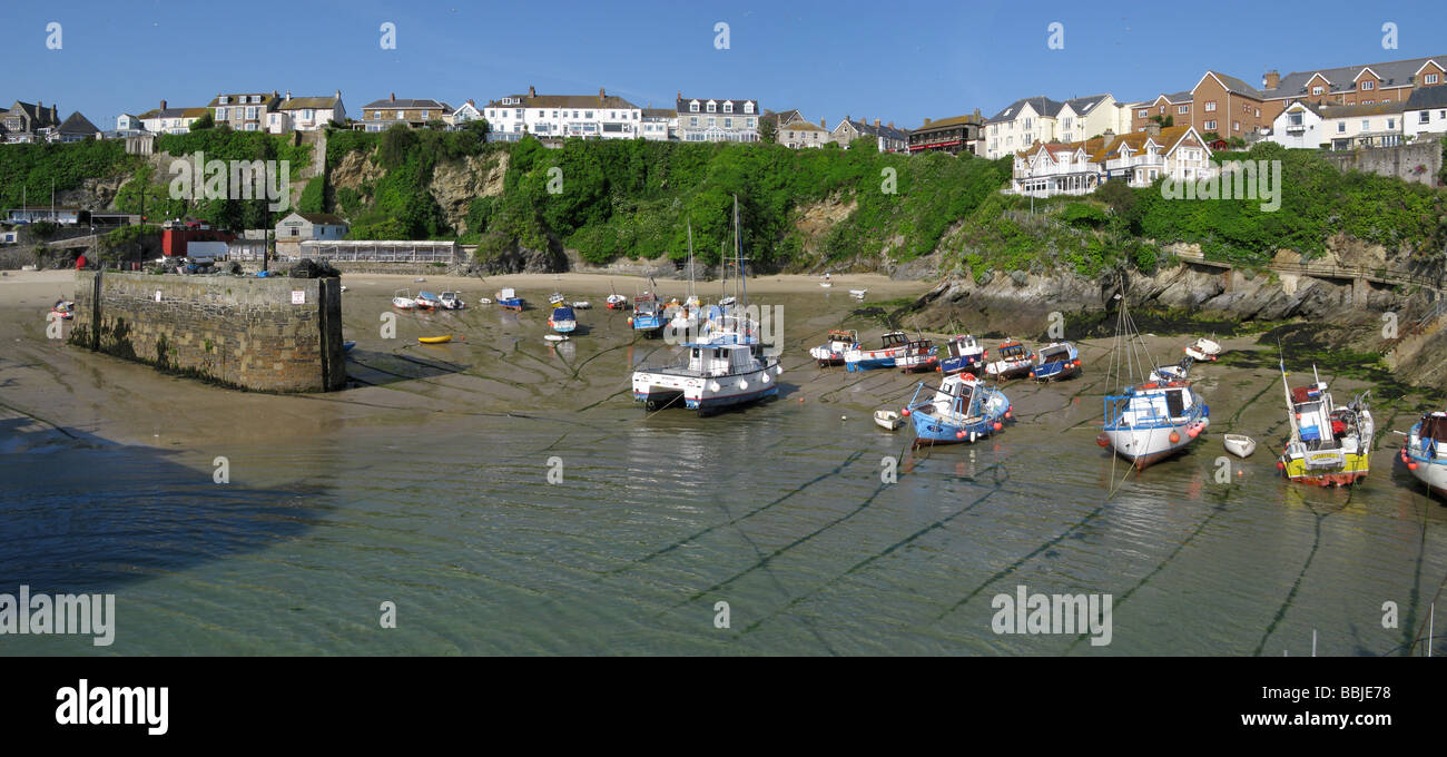 Panoramic view of fishing boats in Newquay harbour at low tide ...