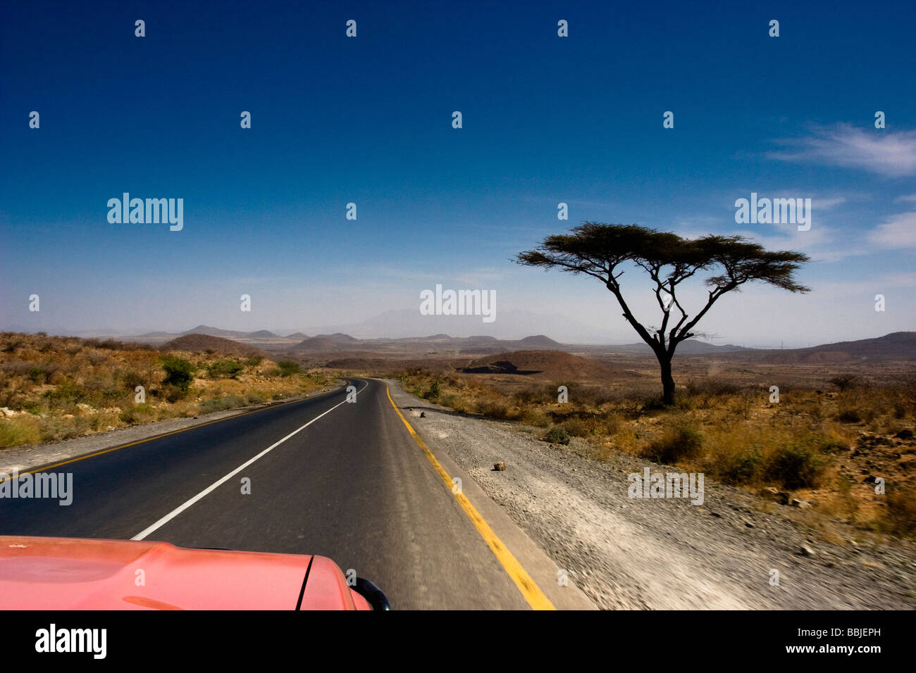 Car driving along straight road hi-res stock photography and images - Alamy