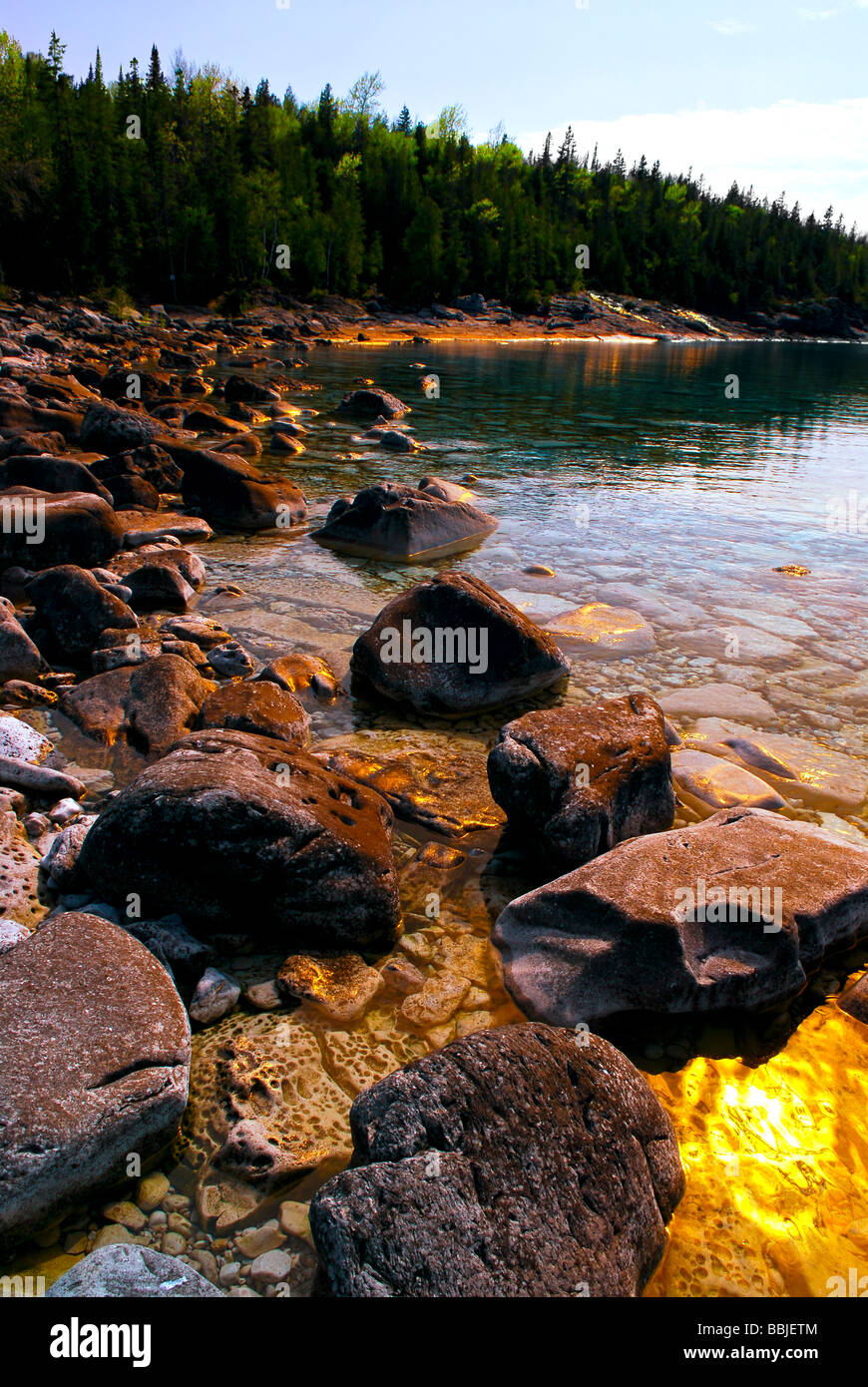 Rocks in clear golden water of Georgian Bay at Bruce peninsula Ontario ...