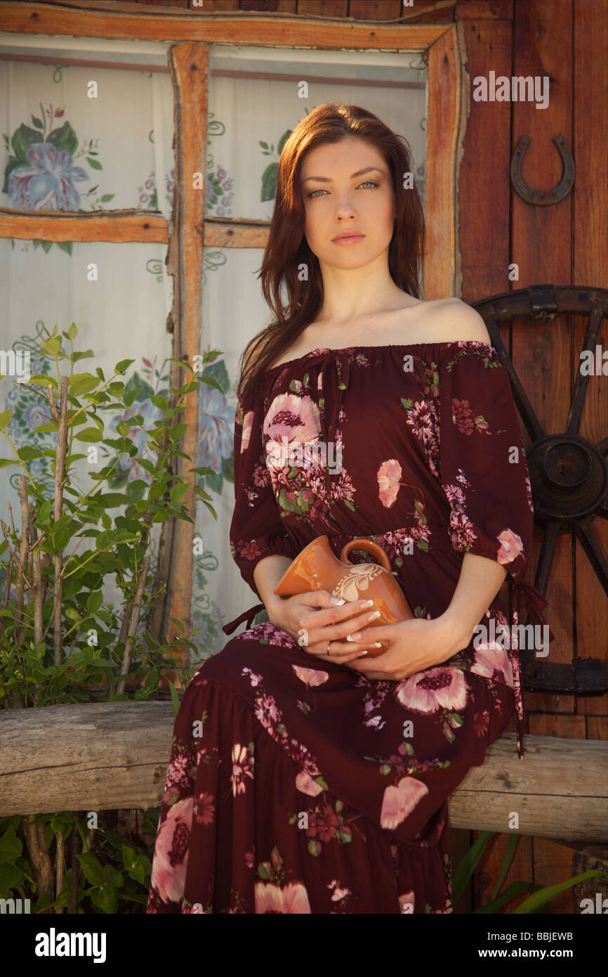 Beautiful rural girl near the dwelling Stock Photo - Alamy