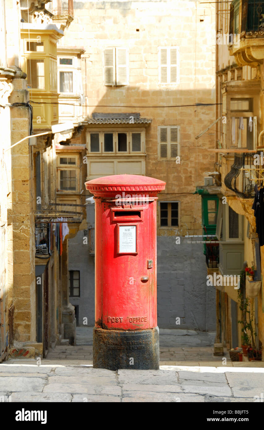 Red british post box in a city street hi-res stock photography and ...
