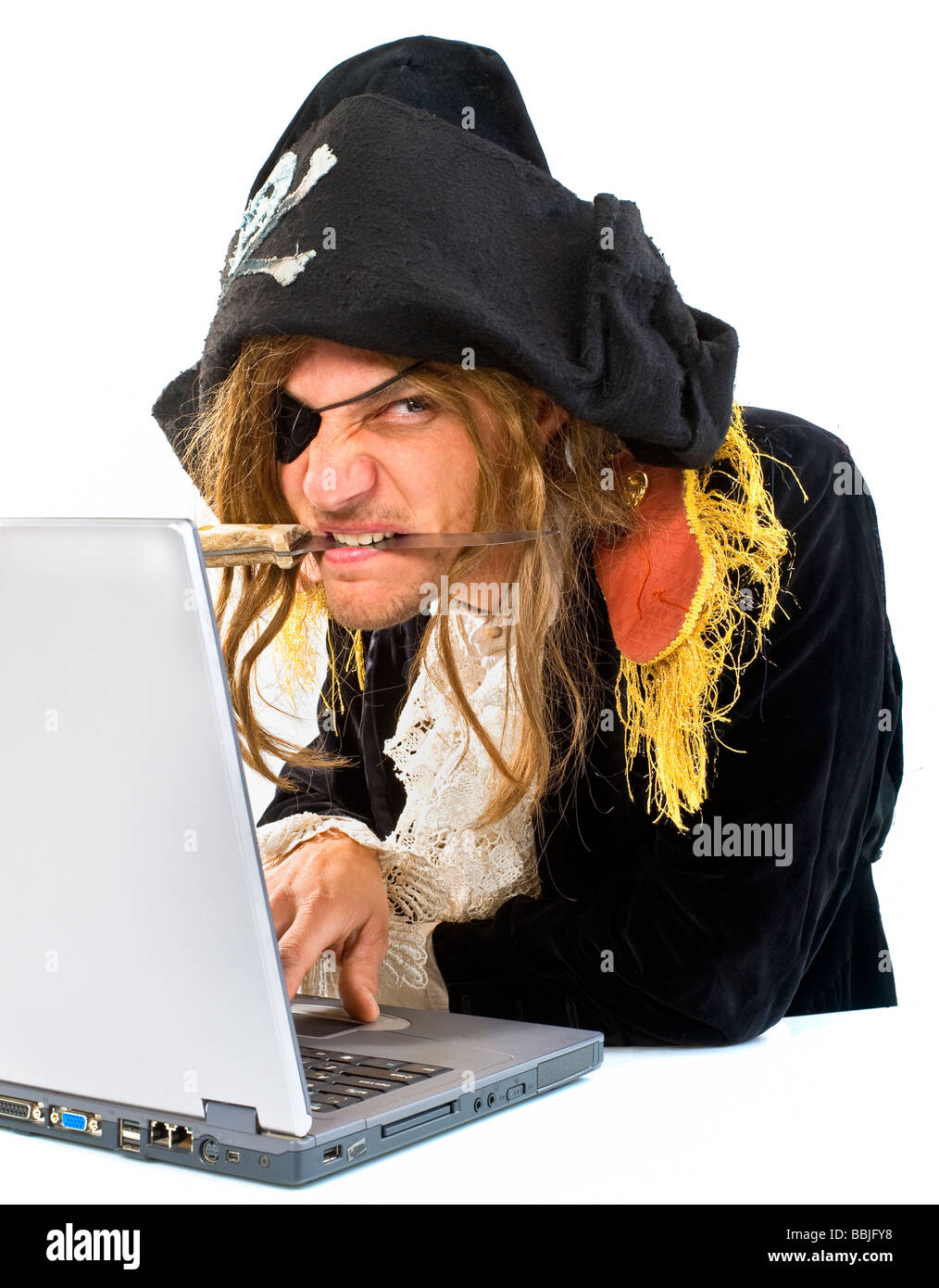 pirate attacking with a knife a laptop computer Stock Photo - Alamy
