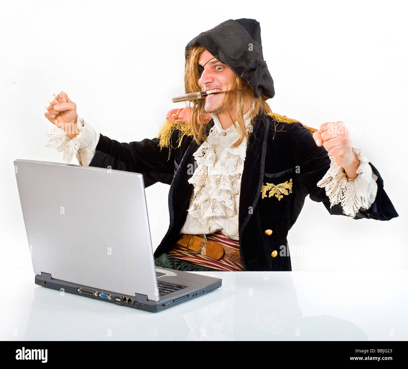 pirate attacking with a knife a laptop computer Stock Photo - Alamy