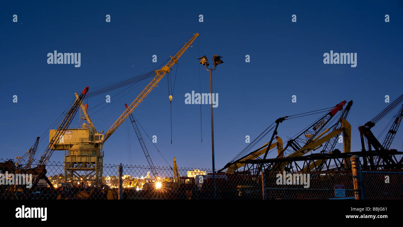 Panorama of heavy machinery at night Stock Photo - Alamy