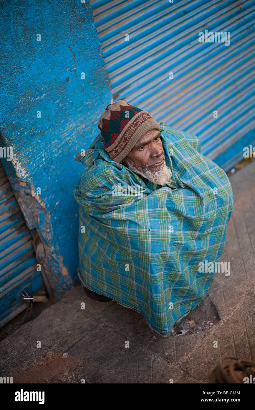 Indian man crouching on wall hi-res stock photography and images - Alamy