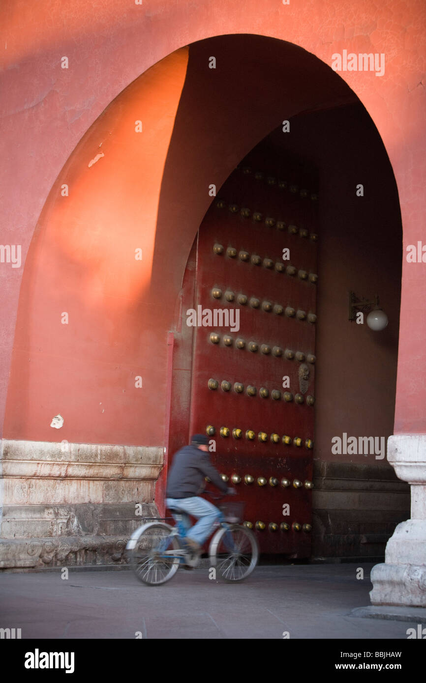 Person cycling through gates hi-res stock photography and images - Alamy