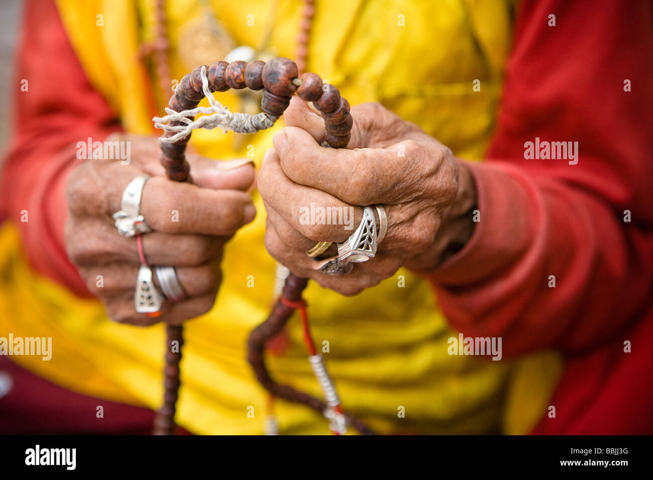 Monk holding prayer beads hi-res stock photography and images - Alamy