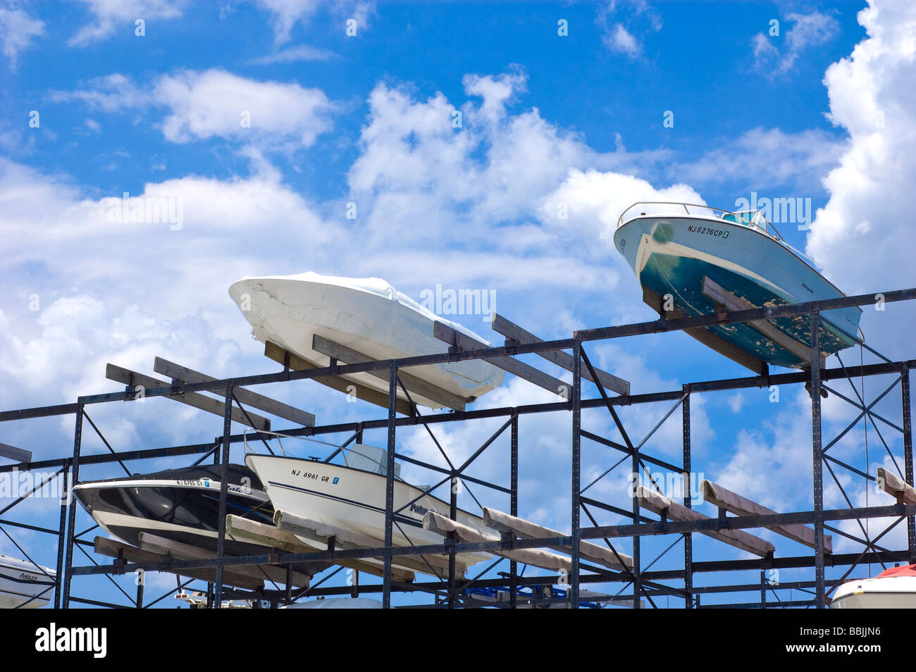 Low angle view of the hull of boats on a boat storage rack Stock Photo ...