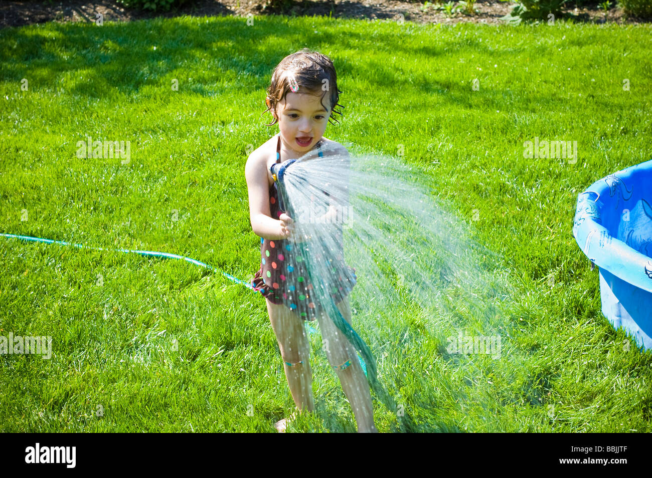 Watering hose rainbow hi-res stock photography and images - Alamy